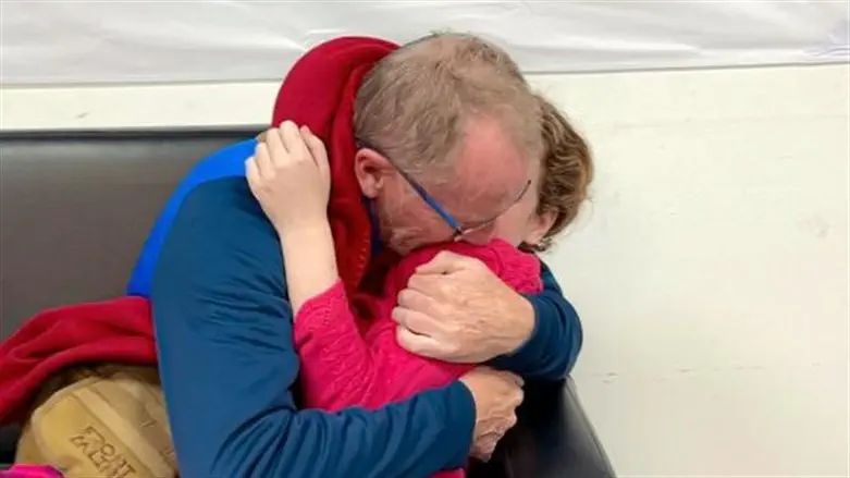 Watch: Freed Emily embraces her father