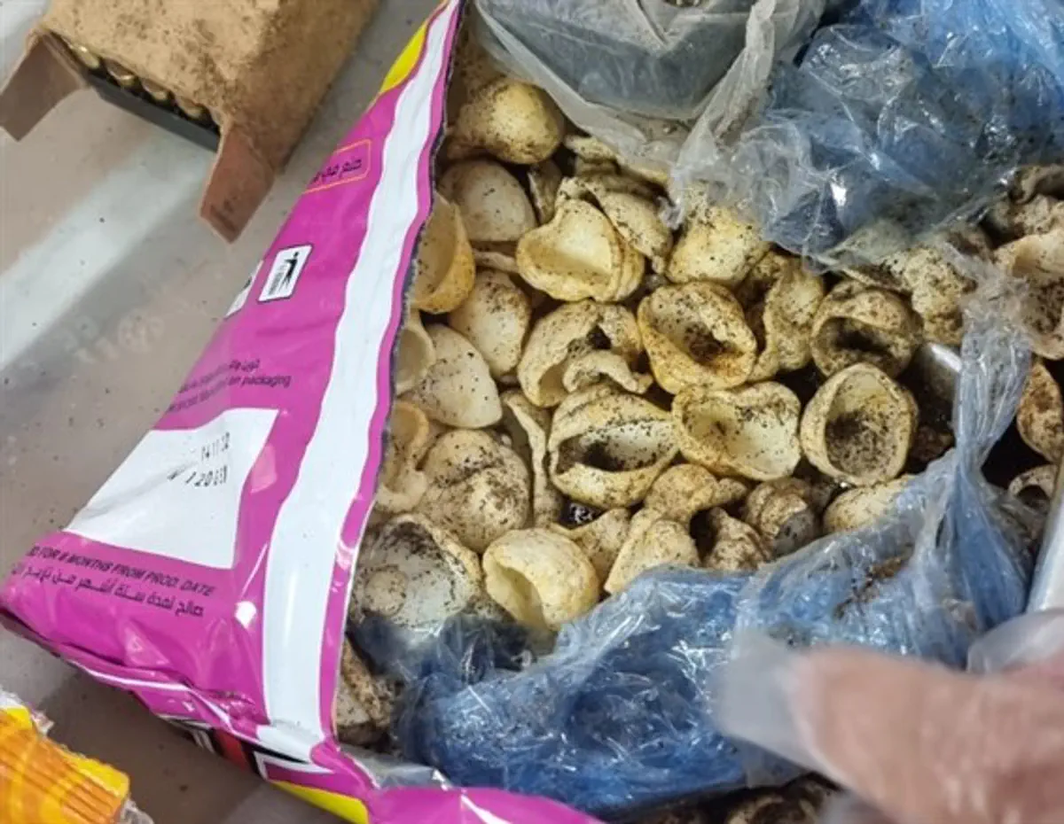 Security forces intercept: Firearm and ammunition hidden in snacks ...