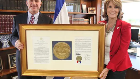 Laurie Cardoza-Moore presents resolution to Yuli Edelstein Courtesy of ...
